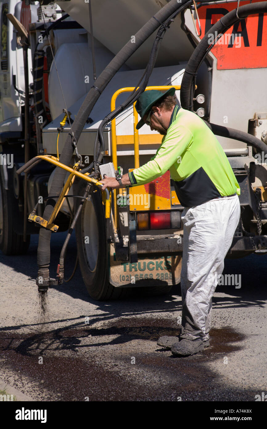 worker repairing a road Stock Photo - Alamy