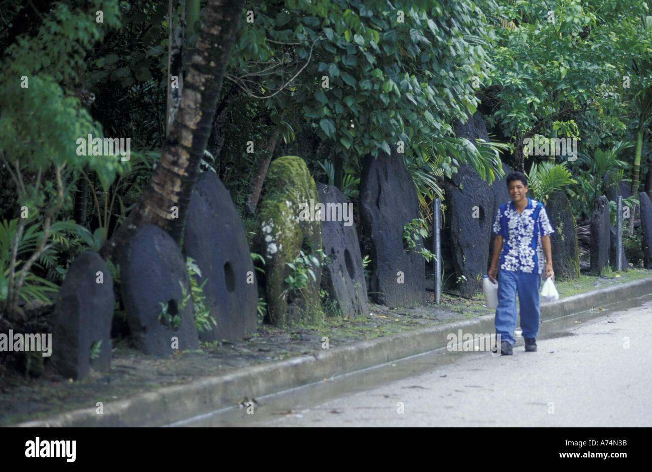 Asia, Micronesia, Yap. Ruul. Stone money lines village street Stock ...