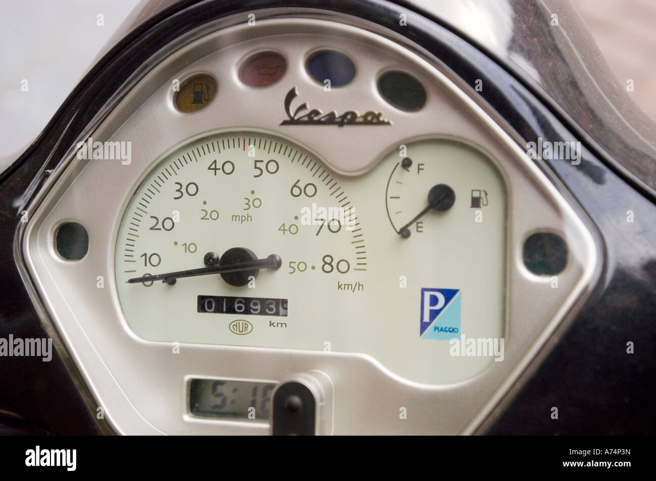 Close-up of a vintage-style Vespa scooter speed meter featuring an ...