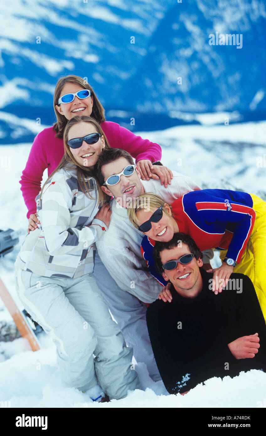 group of friends posing for portrait in winter Stock Photo - Alamy