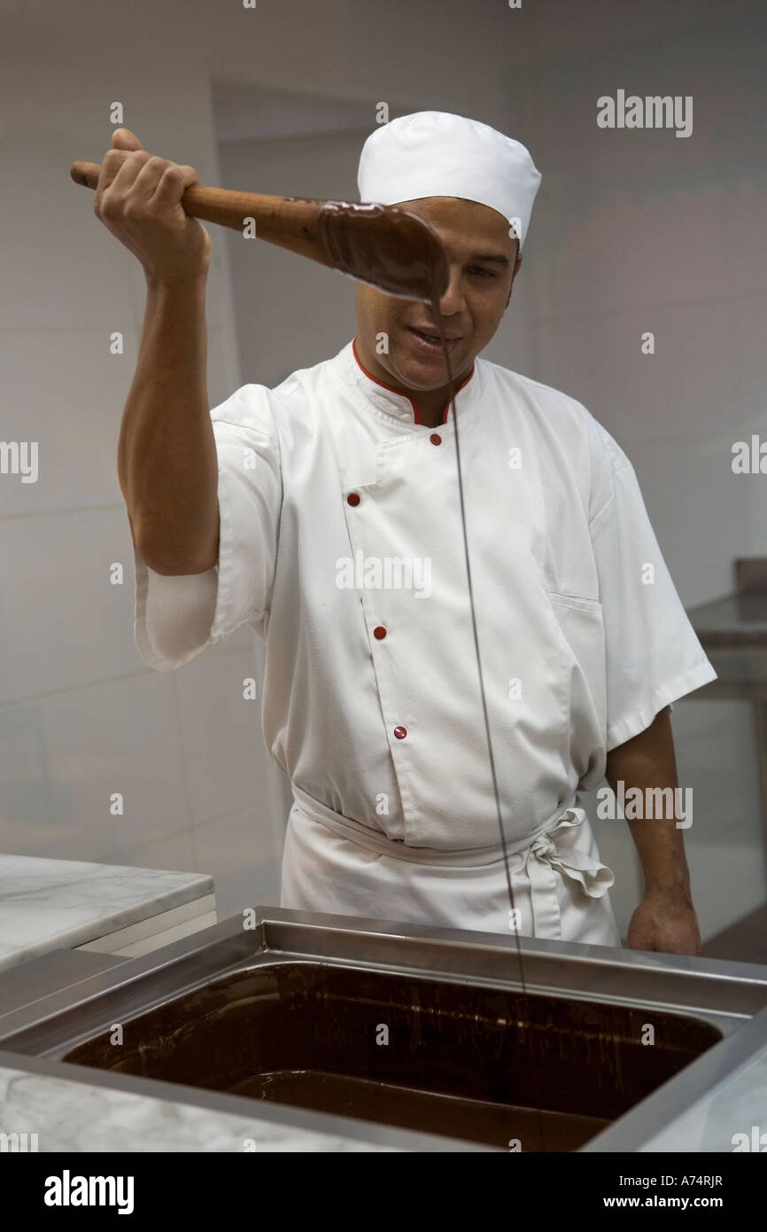 Baker making chocolate Stock Photo - Alamy
