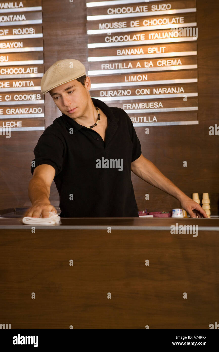 Waiter wiping down bar Stock Photo - Alamy