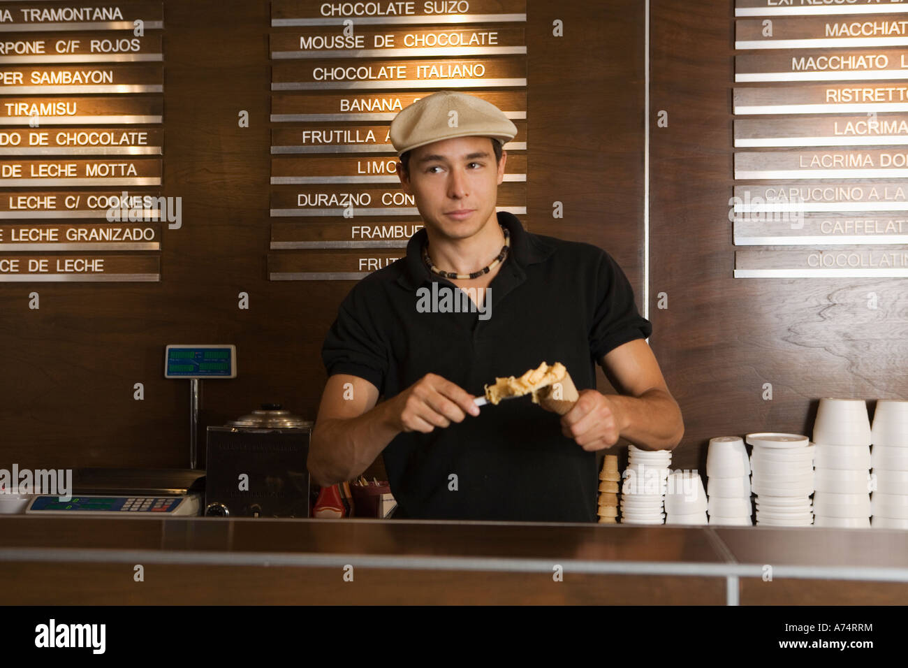 Waiter preparing food behind bar Stock Photo - Alamy
