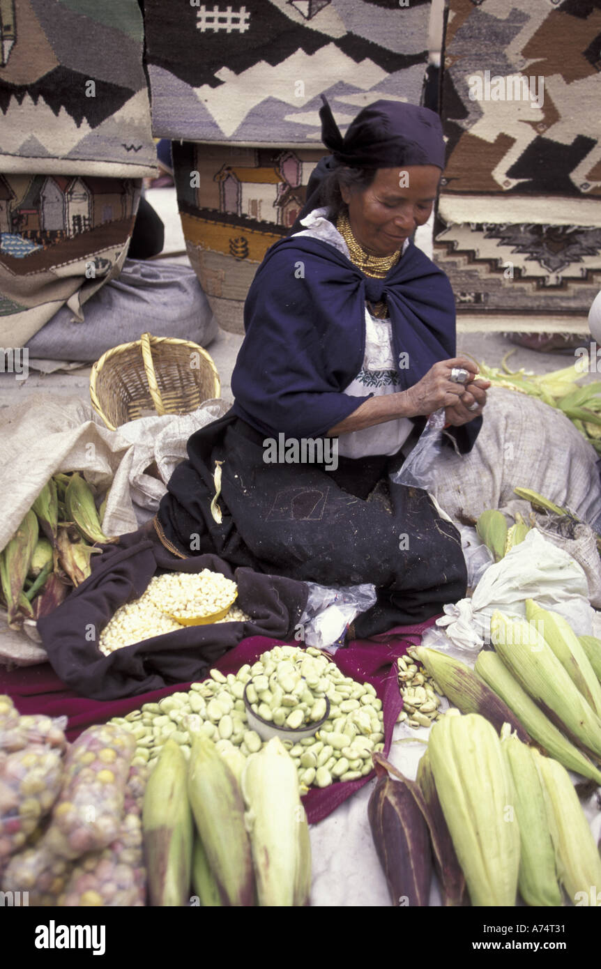 S.A., Ecuador, Highlands, Otavalo Market. Quechua woman selling ...