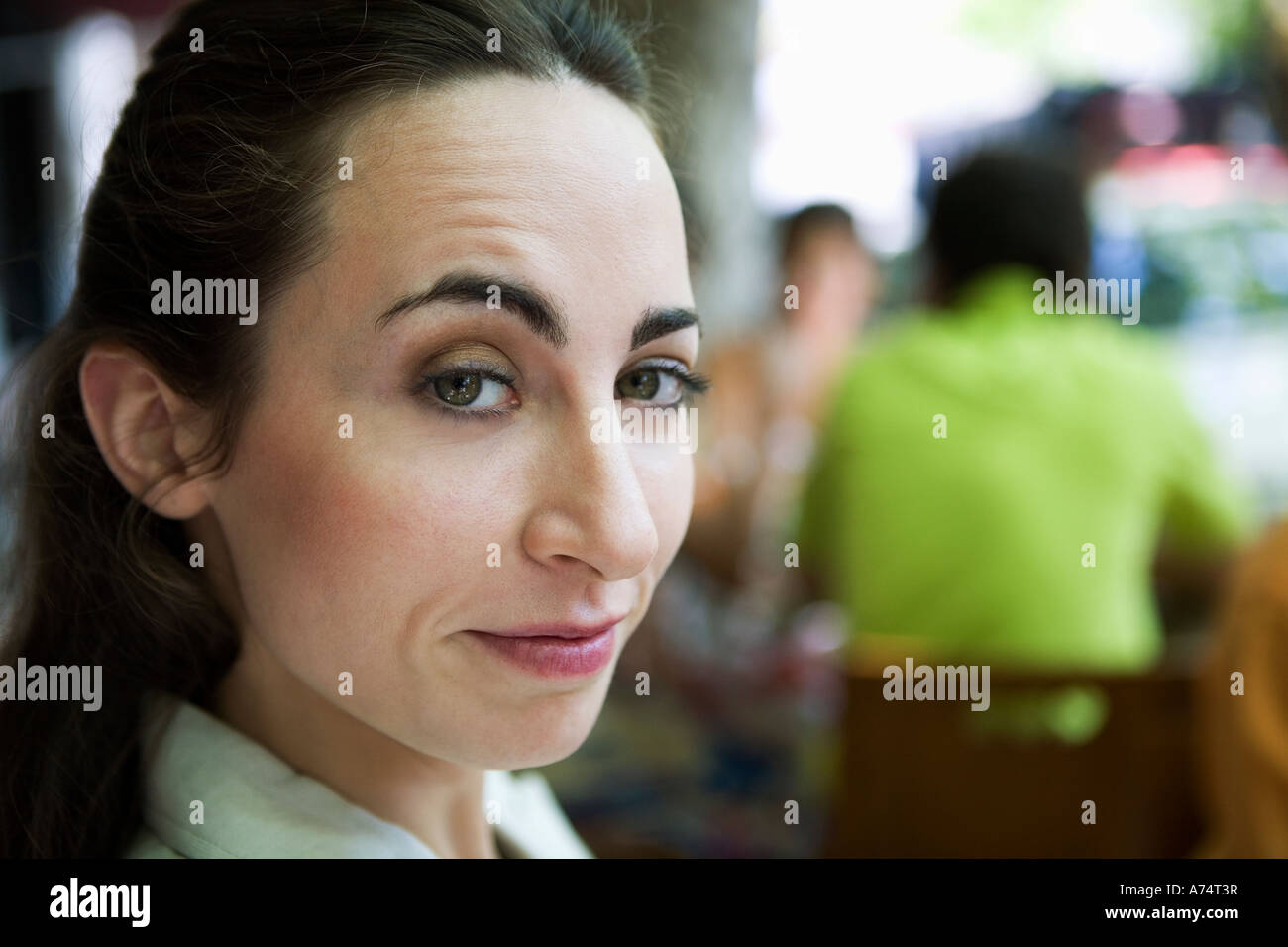 Woman raising an eyebrow Stock Photo - Alamy