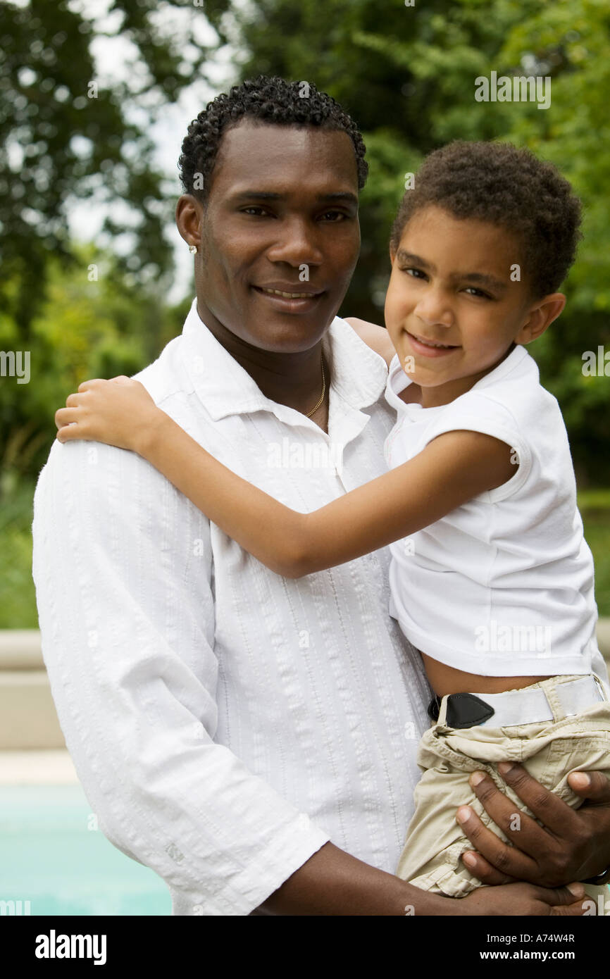 Father carrying son Stock Photo - Alamy