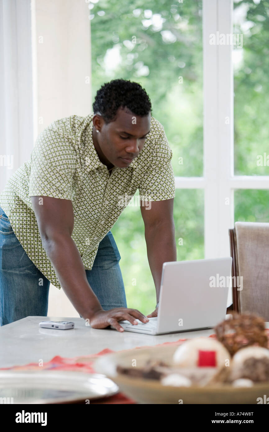 Man using laptop Stock Photo - Alamy