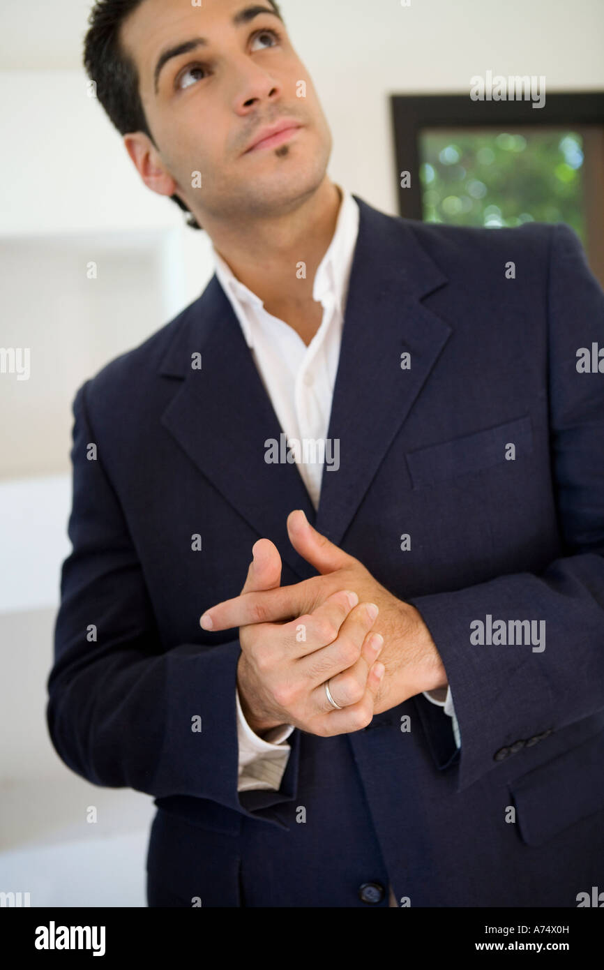 Businessman cracking his knuckles Stock Photo - Alamy