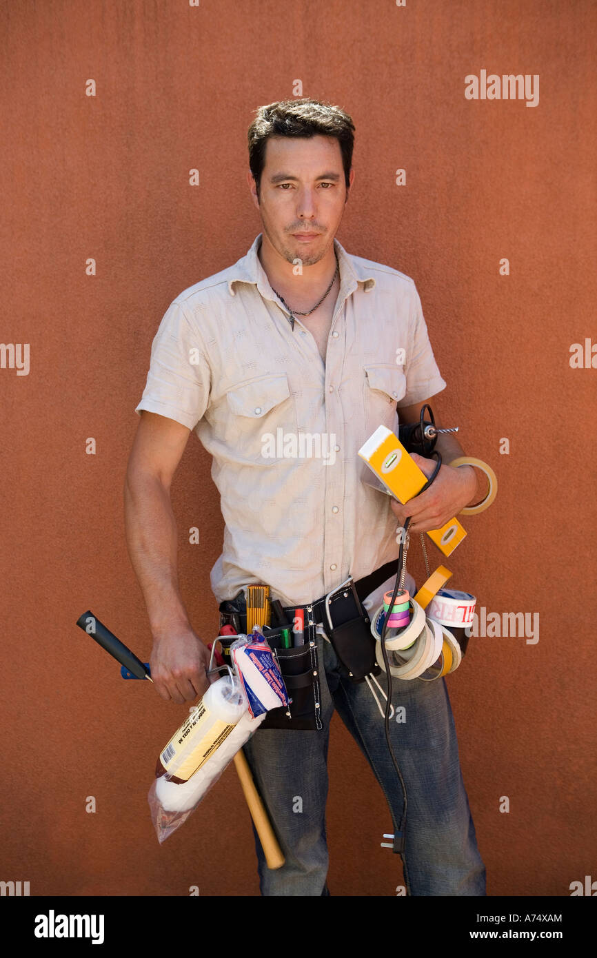 Construction worker wearing tool belt Stock Photo - Alamy