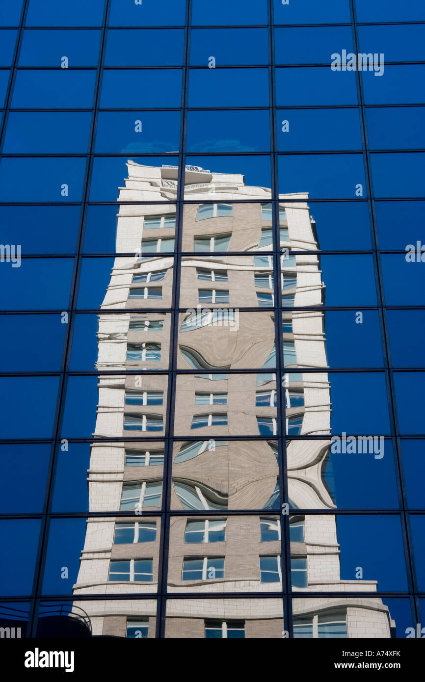 reflection in the panes of glass of building in NYC Stock Photo - Alamy