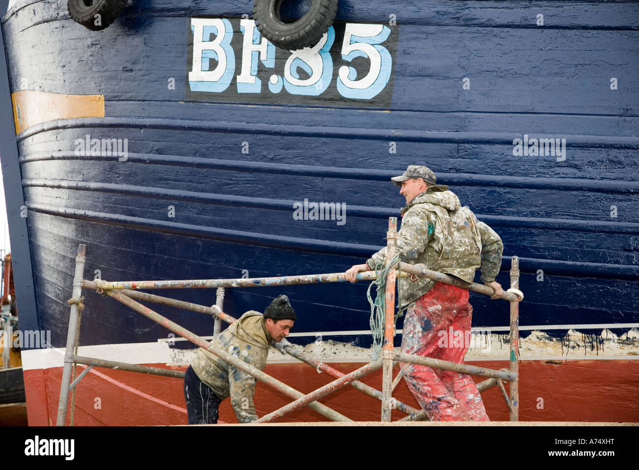 Workmen Boat painting ship number. A ships painter at MacDuff ship and ...