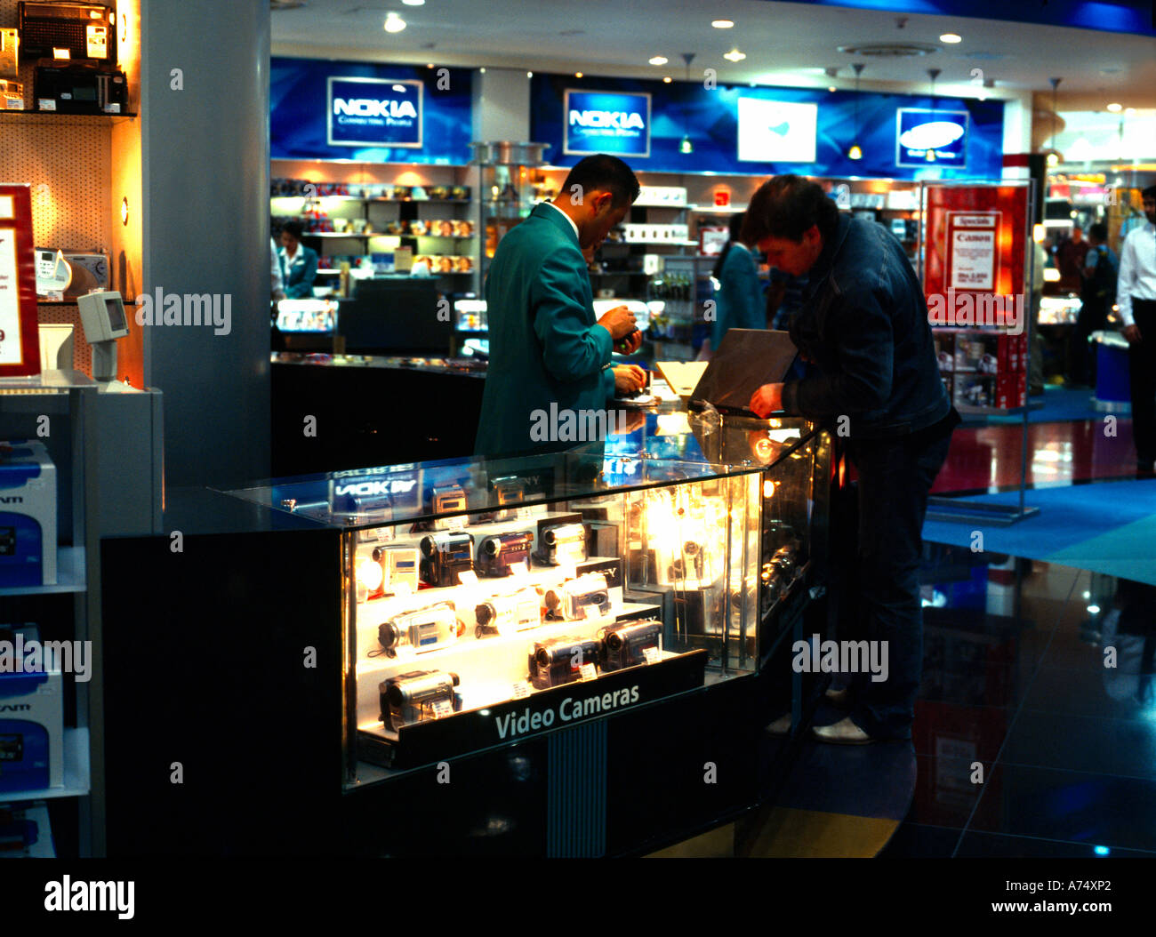 Dubai UAE Airport Duty Free Assistant Serving Customer in Electrical ...