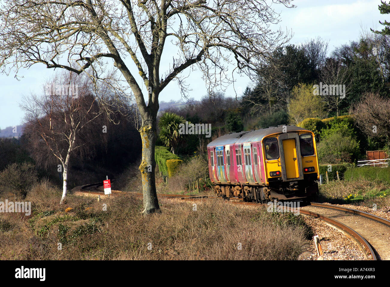 A train winds through countryside between Exeter and Exmouth Stock ...