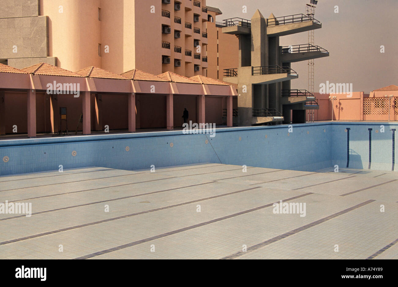 Empty swimming pool in the grounds of a hotel under construction in ...