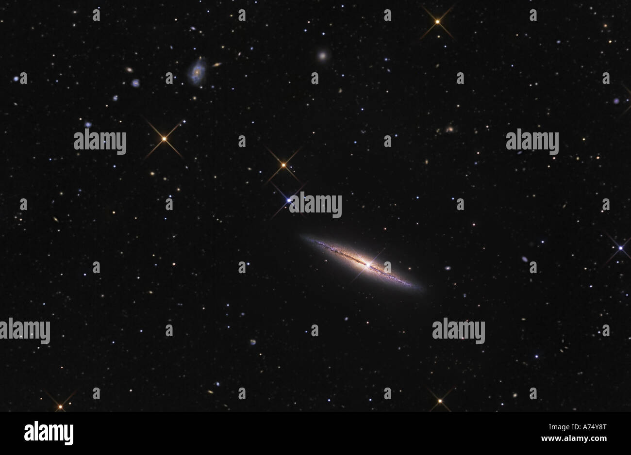 A close up of NGC 4013, an edge-on unbarred spiral galaxy in the ...