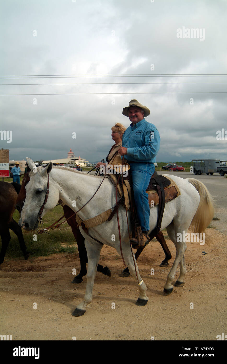 A cowboy riding a white horse in Bandera Texas Stock Photo - Alamy