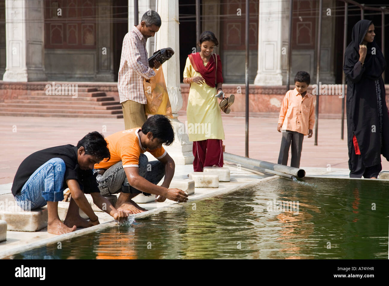 Muslims washing before prayer at the Jami Masjid Mosque in Delhi India ...