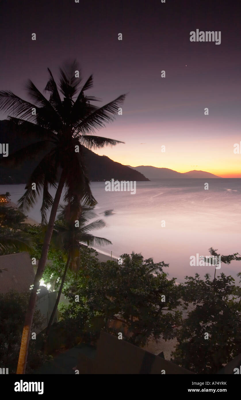Sunset Over Tropical Beach Stock Photo - Alamy