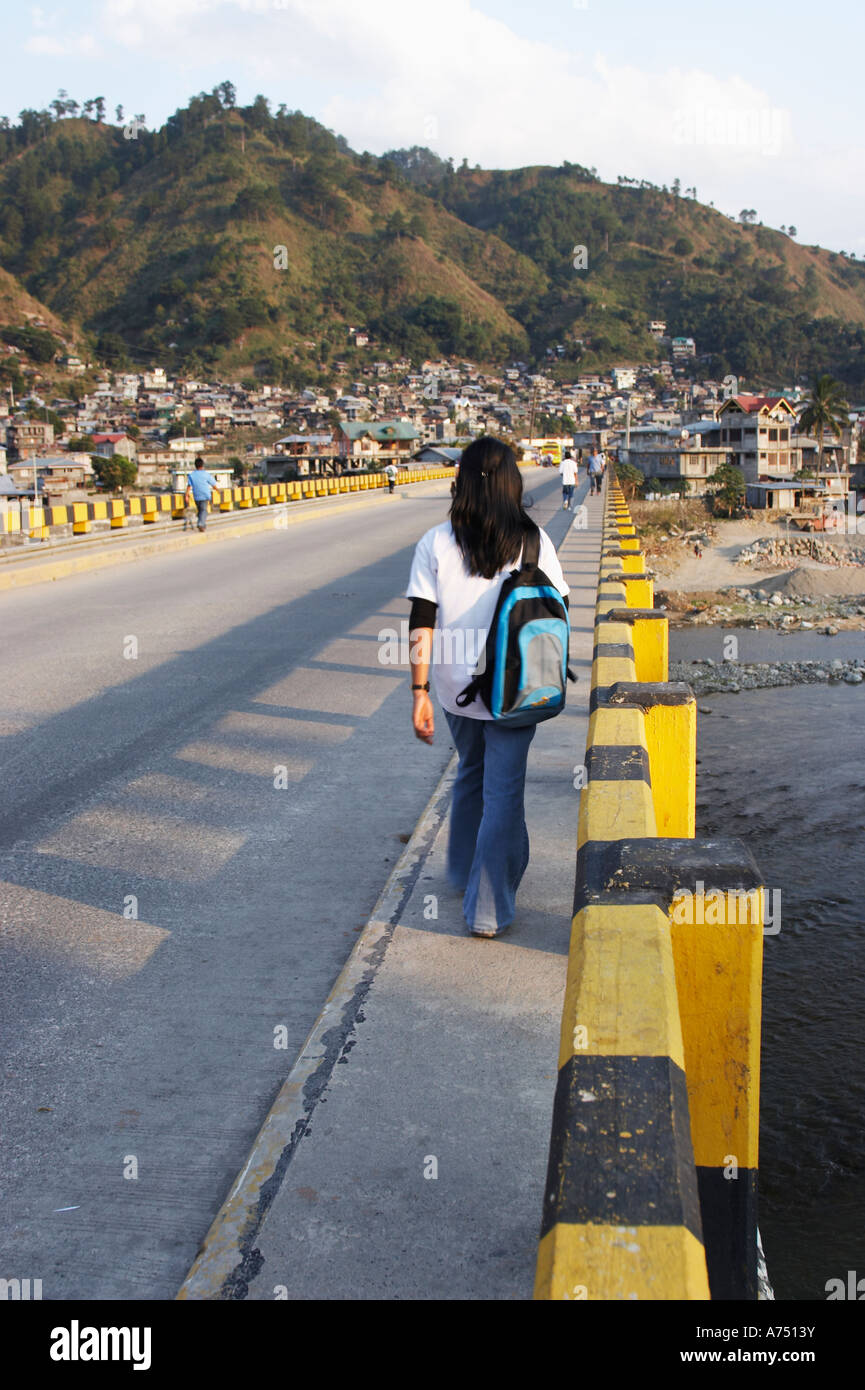 Girl Walking Across Bridge Stock Photo - Alamy