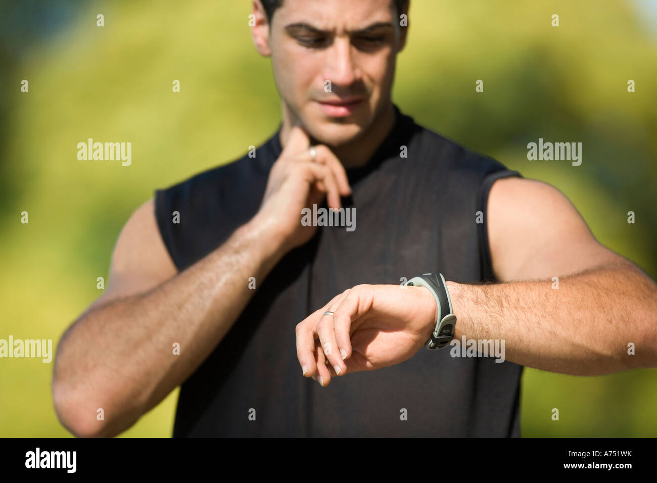 Man checking his own pulse Stock Photo - Alamy