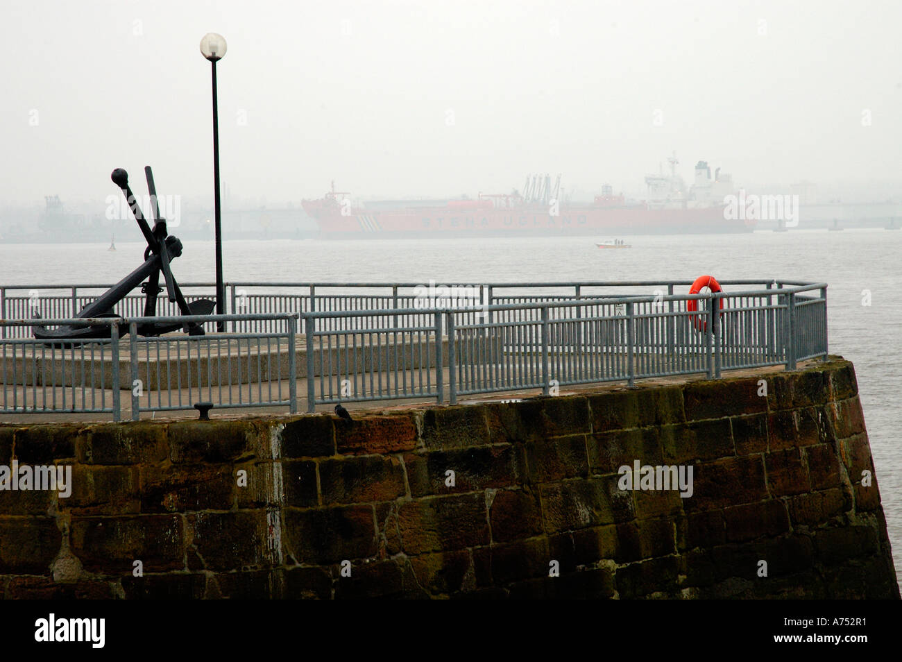 Liverpool docks with a ship in the mist Stock Photo - Alamy