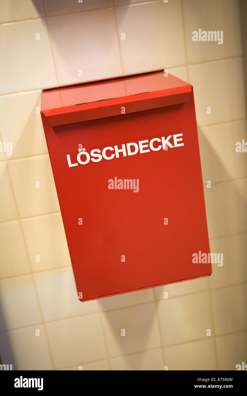 Red locked box attached to wall Stock Photo - Alamy