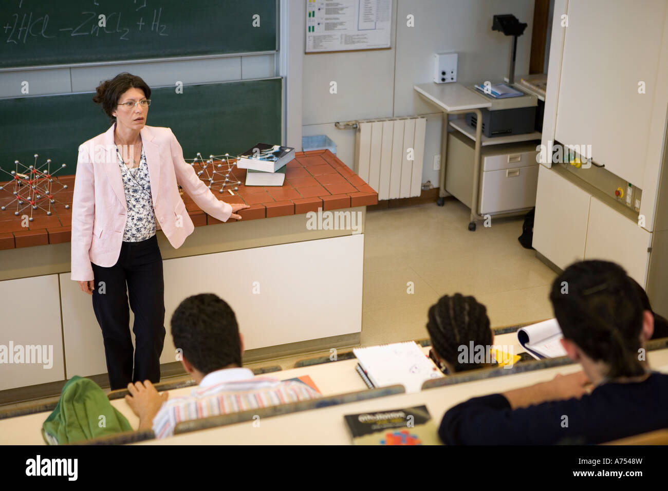 Science teacher lecturing to class Stock Photo - Alamy