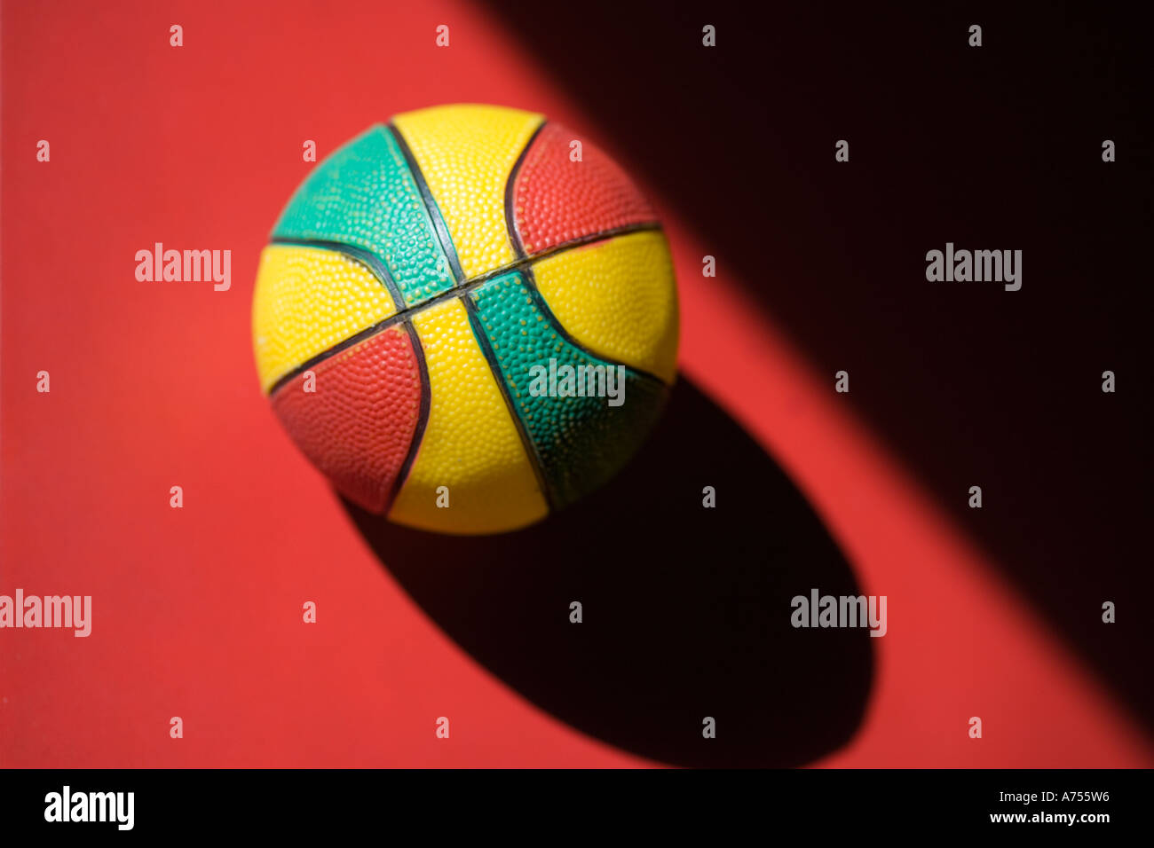 Rubber ball on red table with black shadow abstract Stock Photo - Alamy