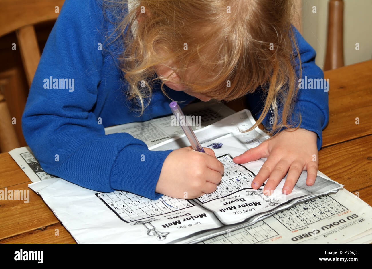 Su Doku sudoku Little girl solving this popular puzzle Stock Photo - Alamy