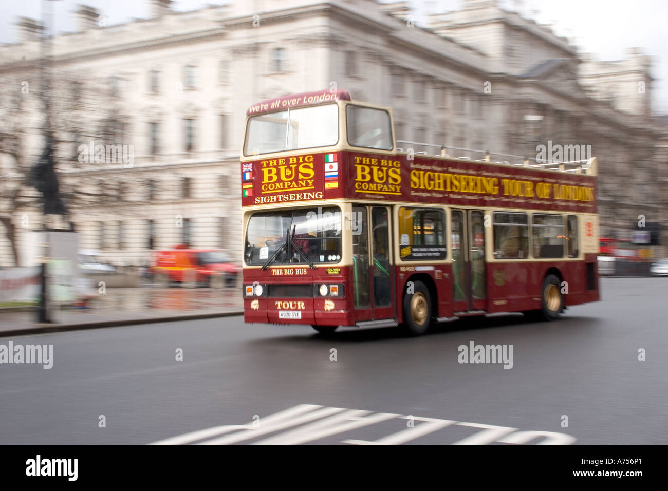 An open top sightseeing bus travels past at great speed Stock Photo - Alamy