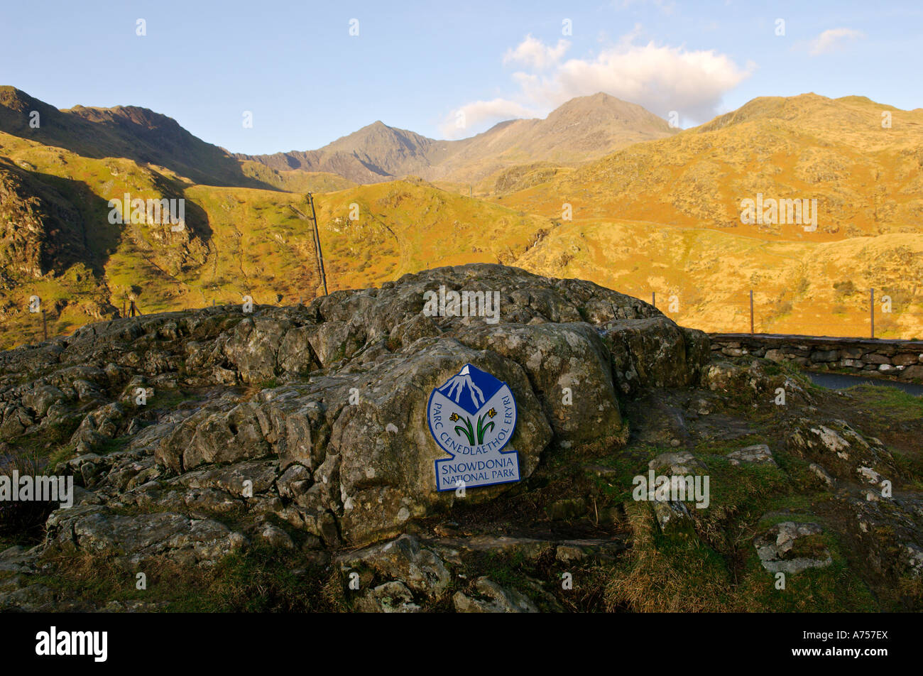 Snowdonia National Park sign on rock with Snowdon in the distance ...