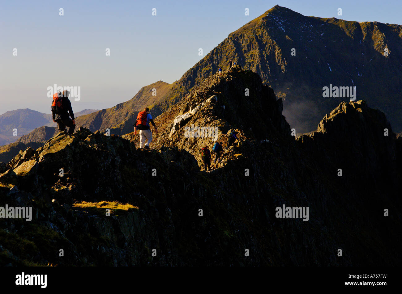 Walkers on the Crib Goch ridge with Snowdon in the distance Snowdonia ...