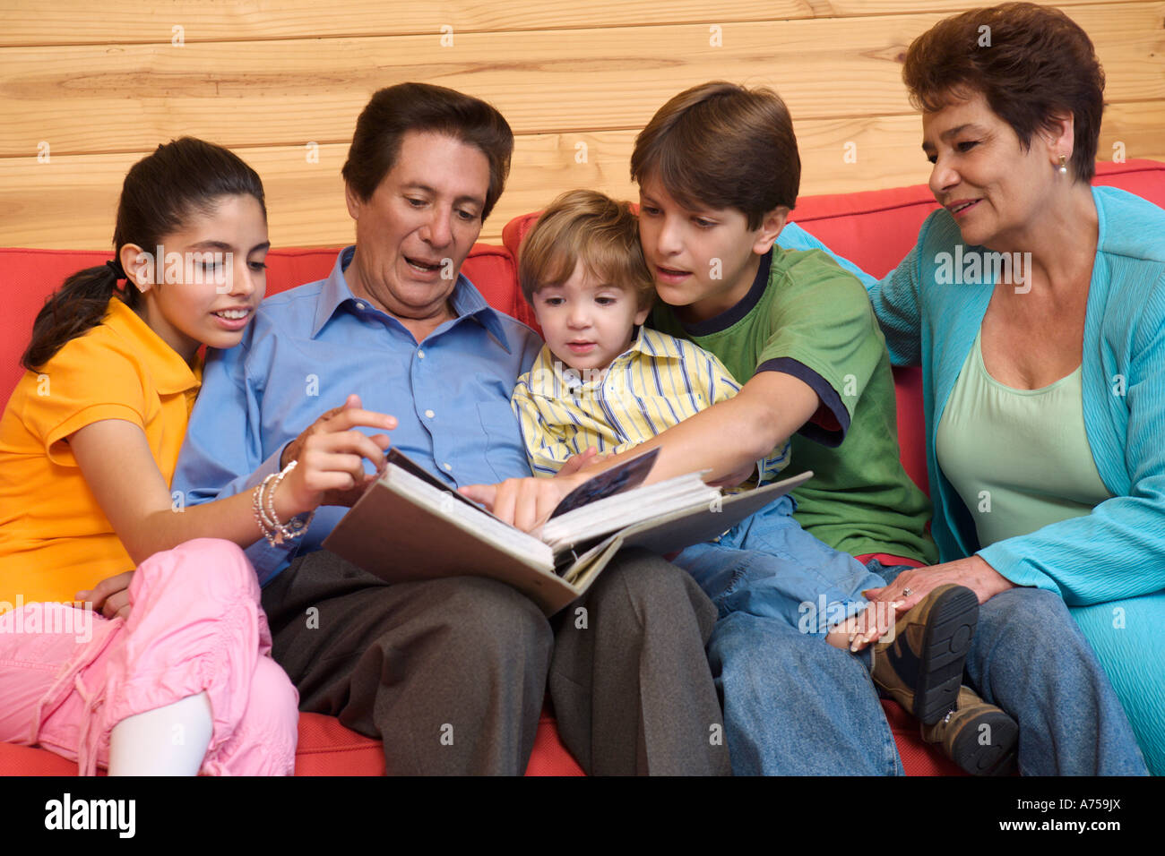 Family reading together Stock Photo - Alamy