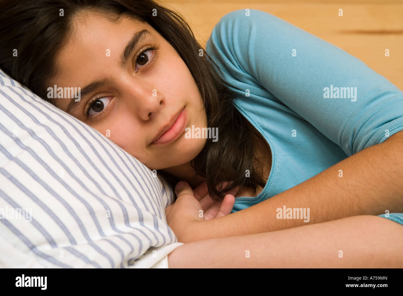 Young girl lying down Stock Photo - Alamy