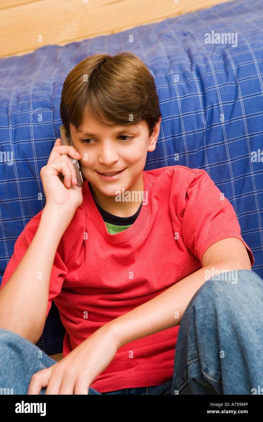 Young boy talking on the phone Stock Photo - Alamy