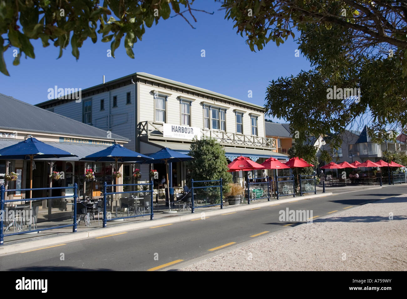 Cafes and shops alongside Akaroa harbour Banks Peninsula New Zealand ...