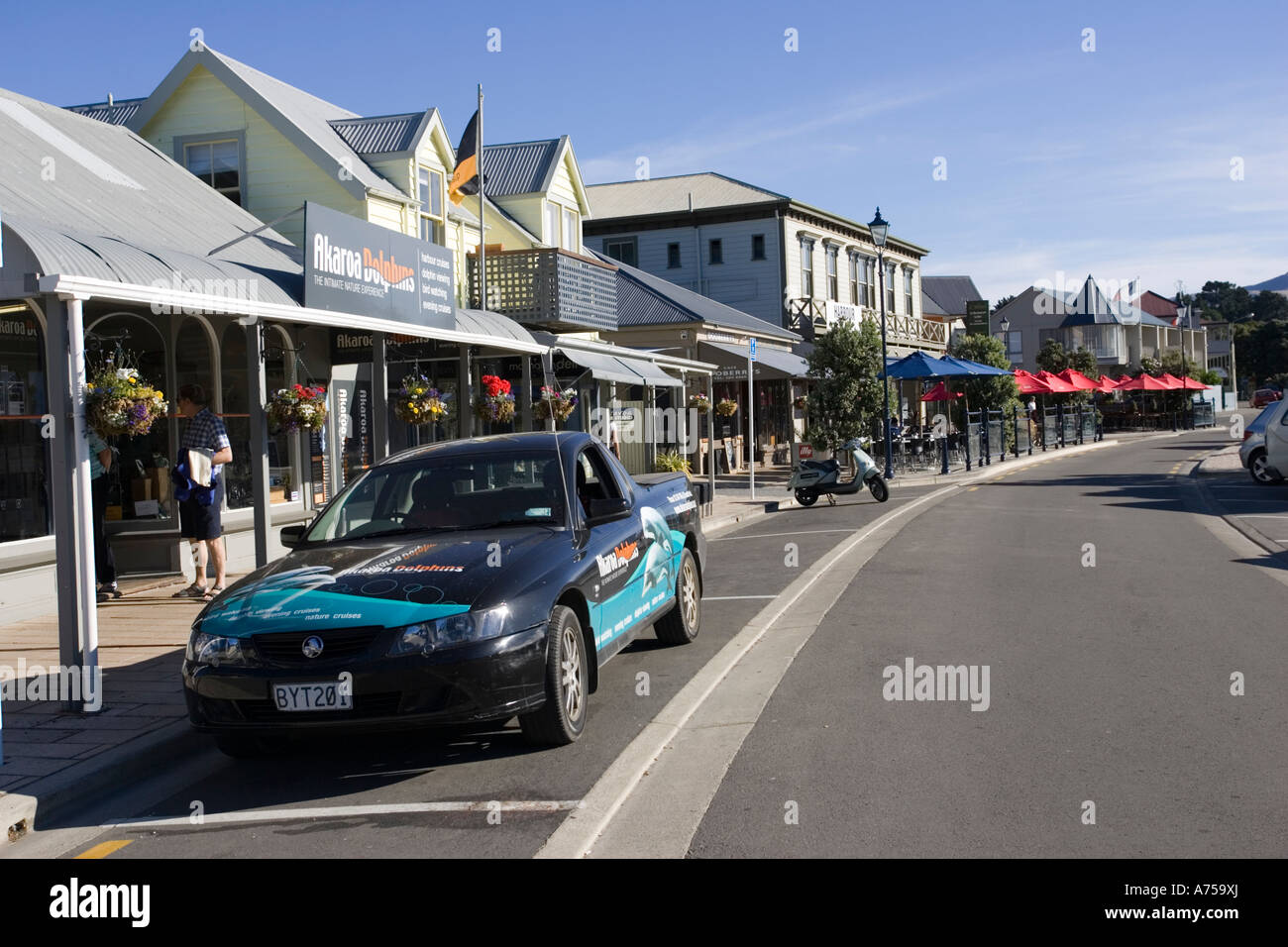 Cafes and shops alongside Akaroa harbour Banks Peninsula New Zealand ...