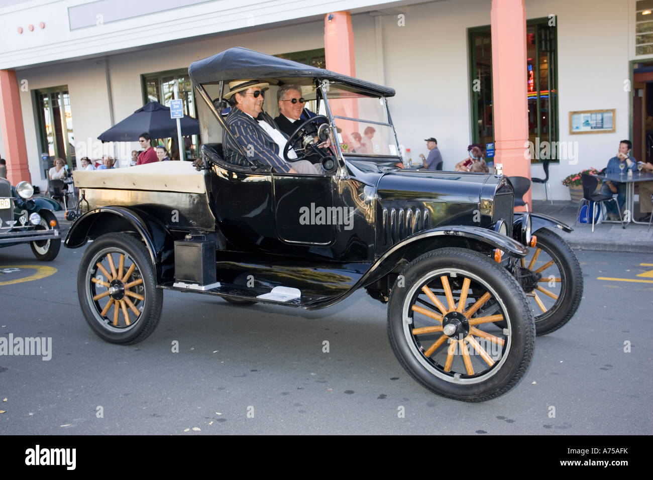 Classic vintage Model T Ford tourer motor car driver dressed in 1930s ...
