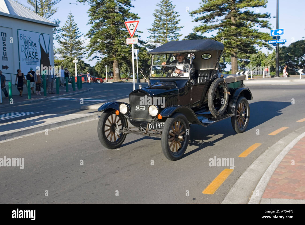 Classic vintage Model T Ford tourer motor car driver dressed in 1930s ...