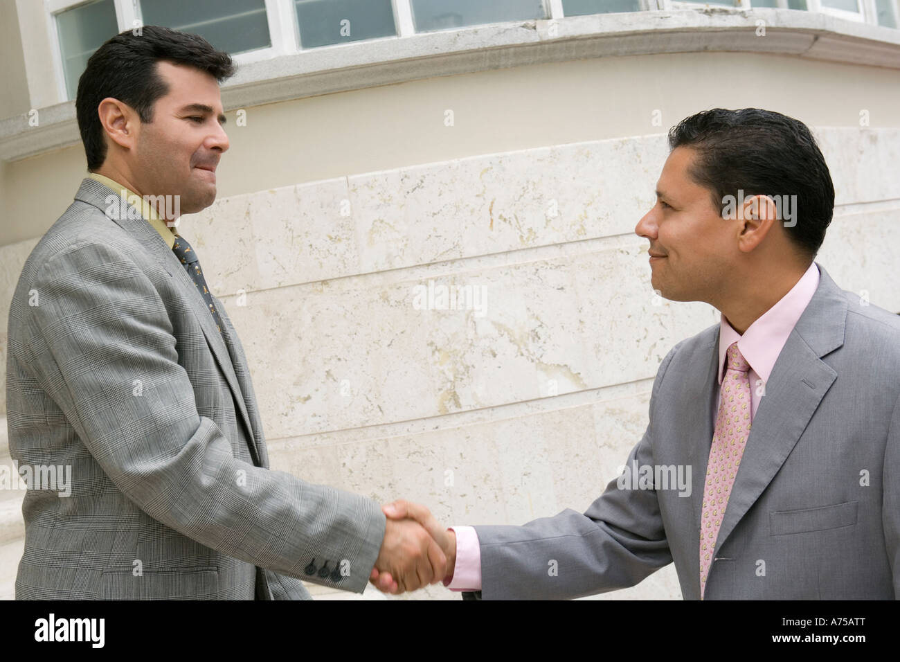 Businessmen shaking hands Stock Photo - Alamy