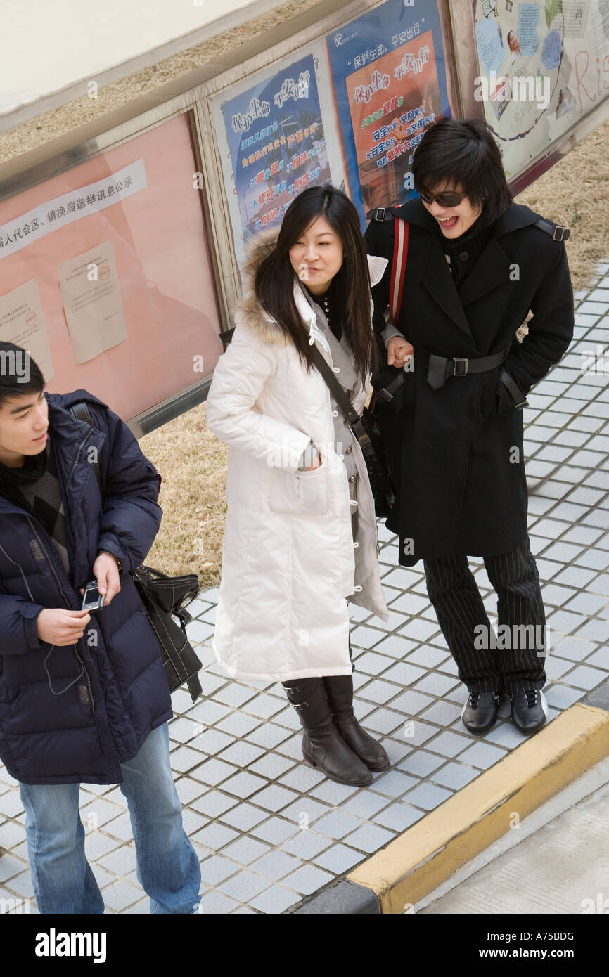 High-angle view of people waiting at curved urban bus stop Stock Photo ...