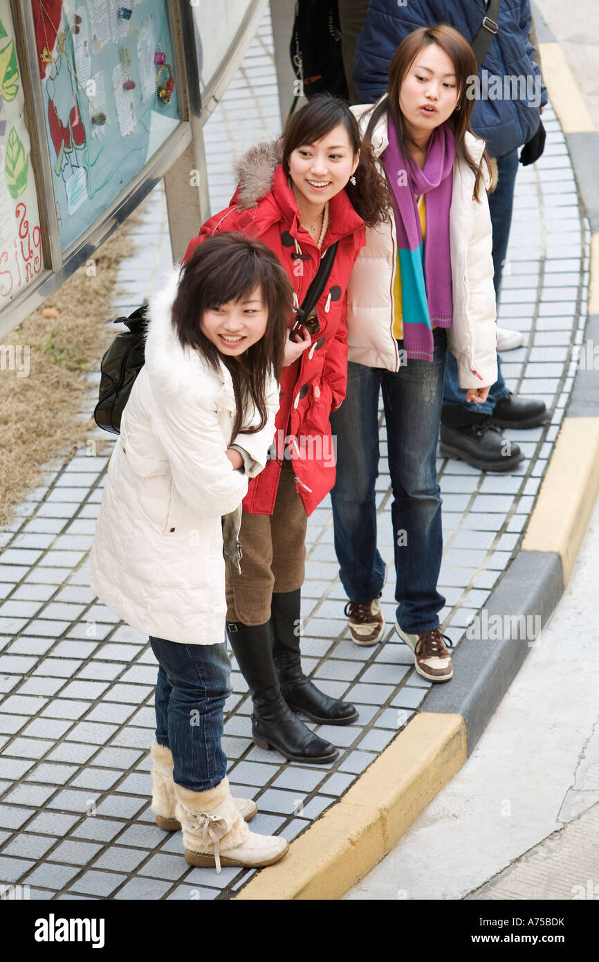 High-angle view of people waiting at curved urban bus stop Stock Photo ...