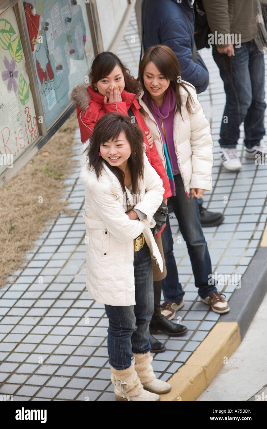 High-angle view of people waiting at curved urban bus stop Stock Photo ...