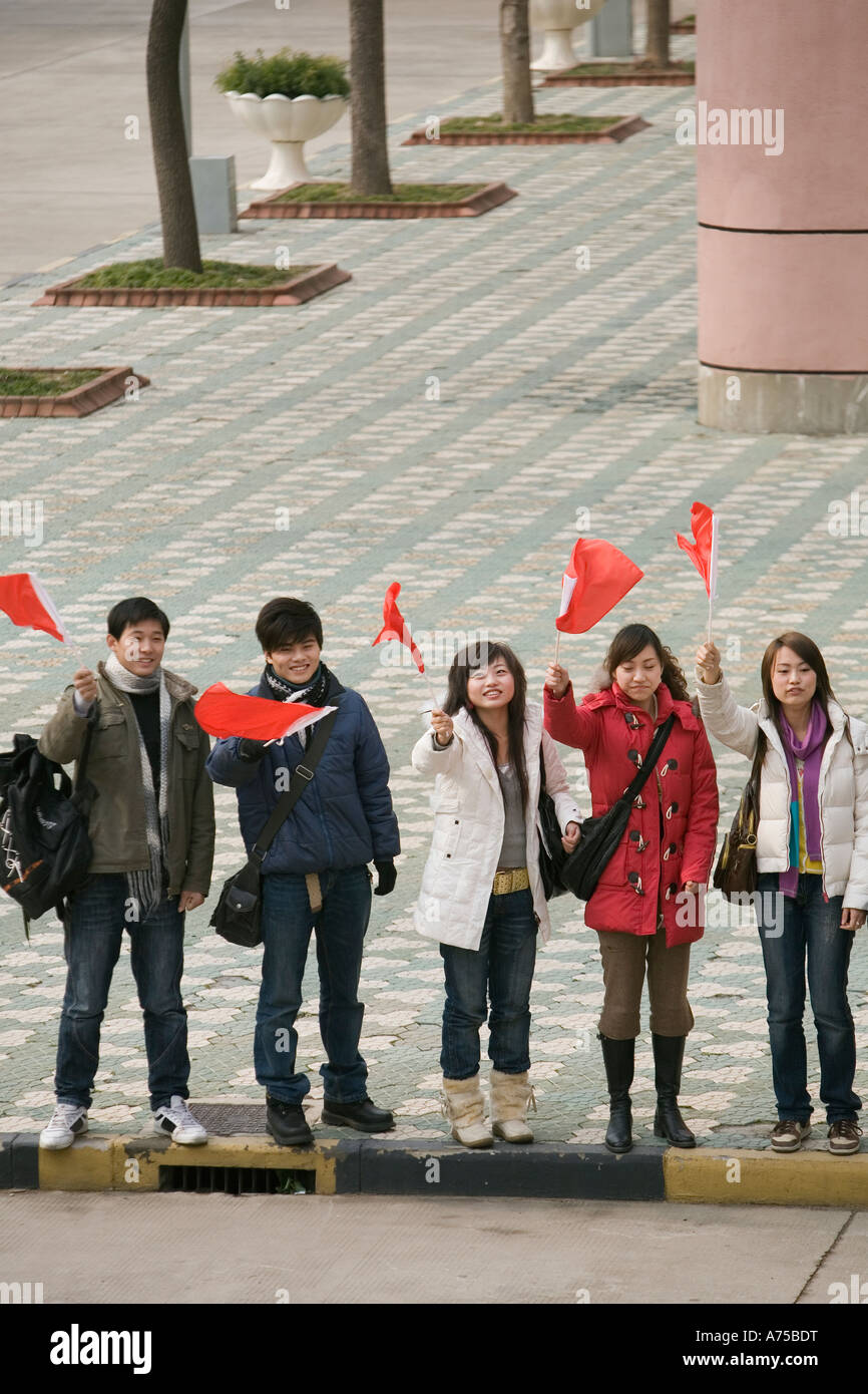 Woman waving chinese flags hi-res stock photography and images - Alamy