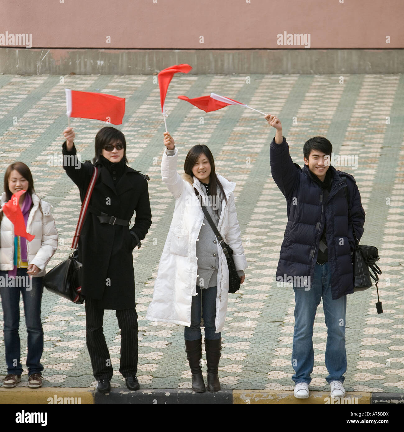 Woman waving chinese flags hi-res stock photography and images - Alamy