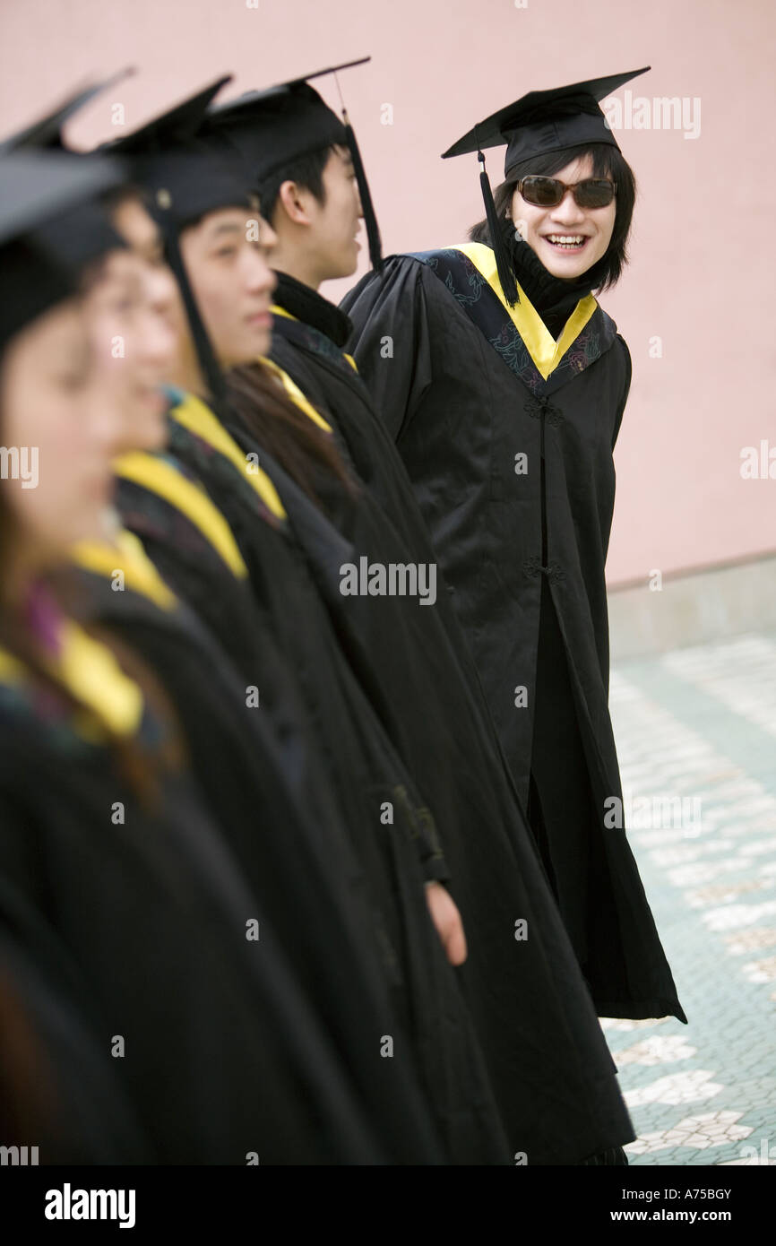Row of students in graduation robes Stock Photo - Alamy