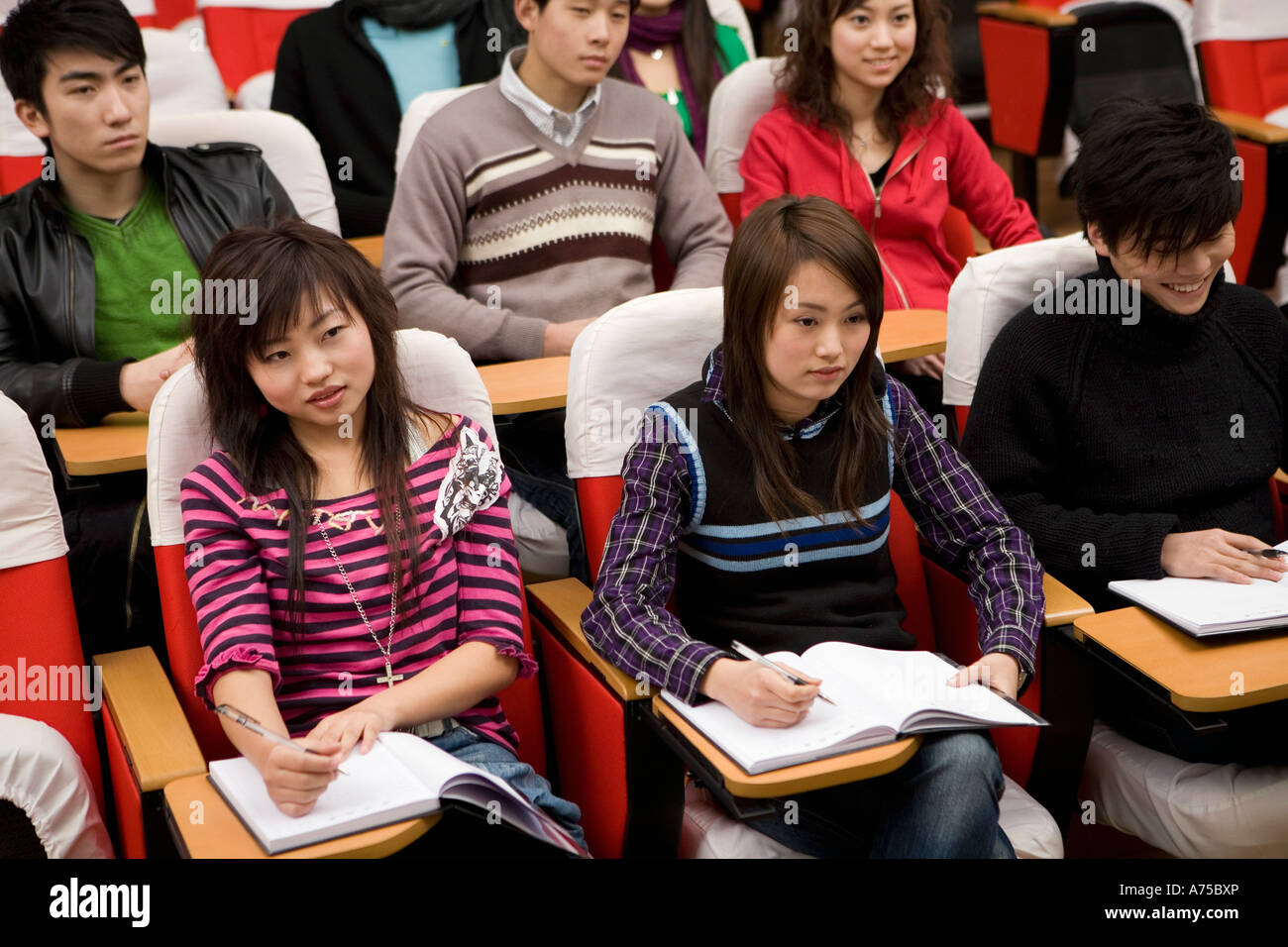 College students taking notes in class Stock Photo - Alamy