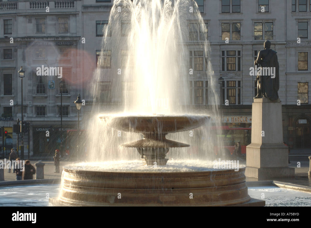 Trafalgar Square, London, England statue in fountain with water detail ...