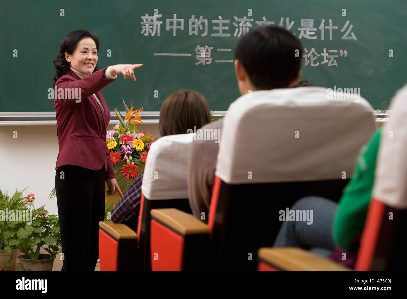 Teacher calling on student Stock Photo - Alamy