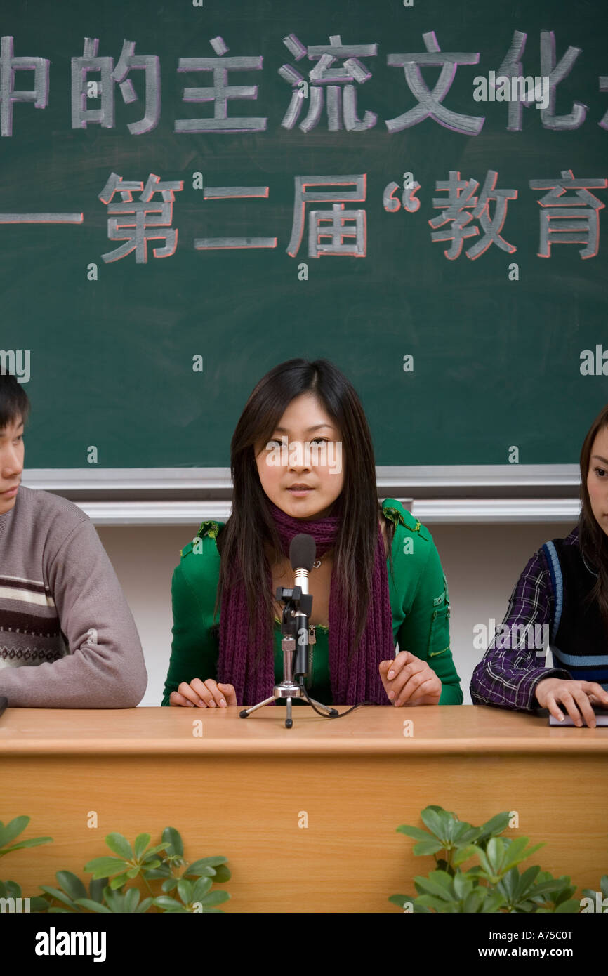 Sitting behind a microphone hi-res stock photography and images - Alamy